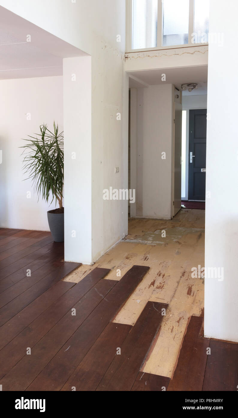 Breaking up a solid wooden floor in a house Stock Photo - Alamy