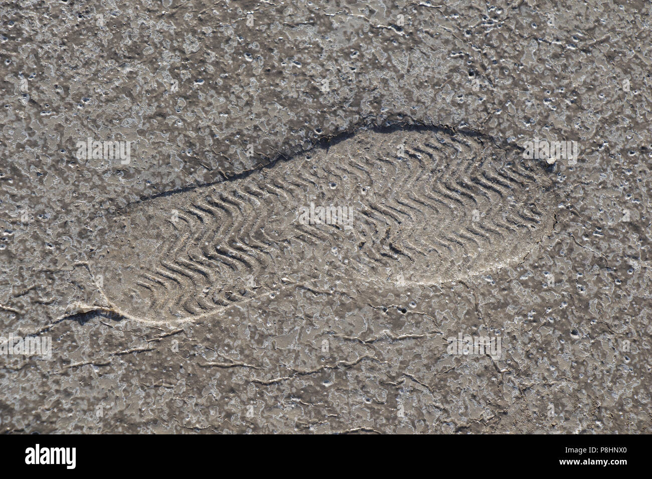 Footstep pattern seen on a concrete background Stock Photo - Alamy