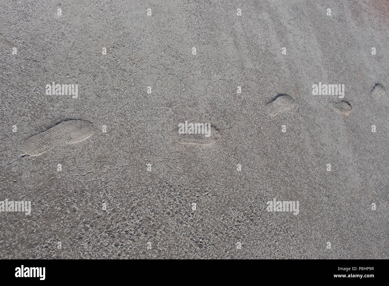 Footstep pattern seen on a concrete background Stock Photo - Alamy