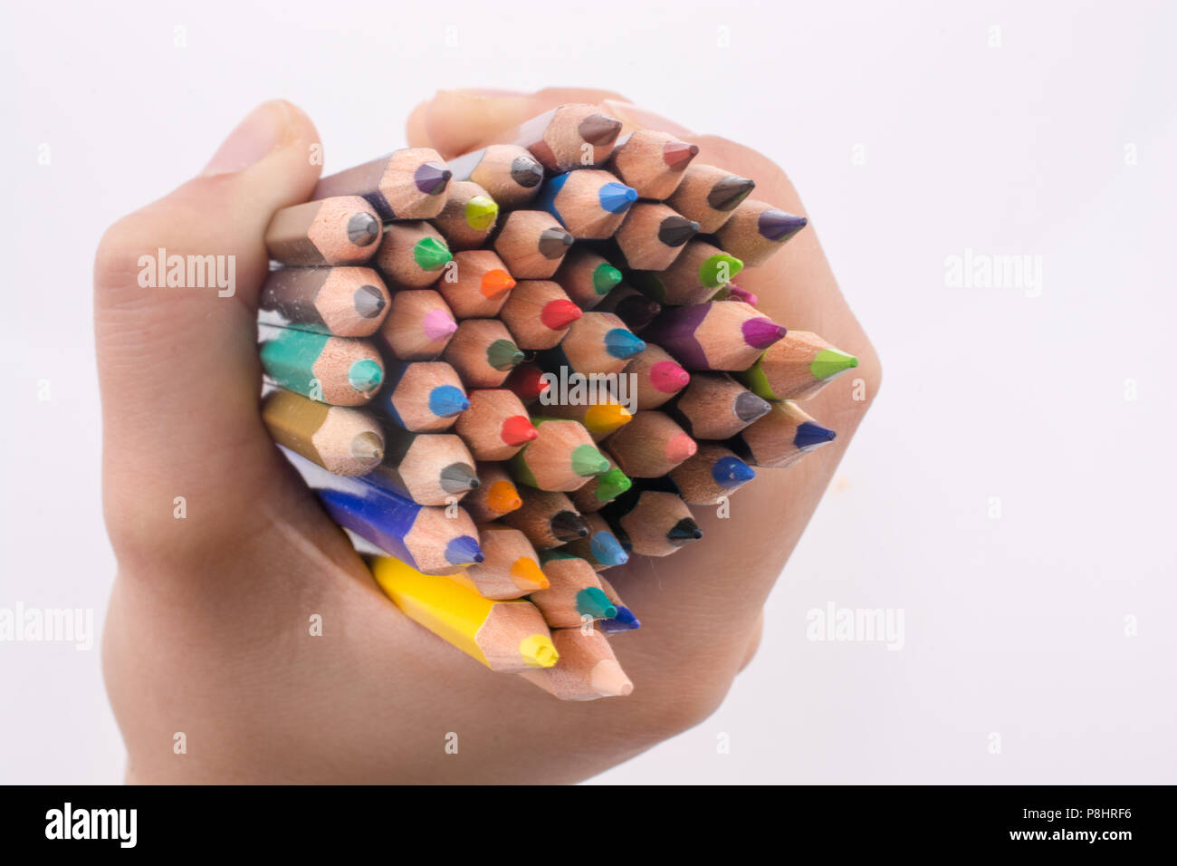 Hand holding Color pencils on a white background Stock Photo - Alamy