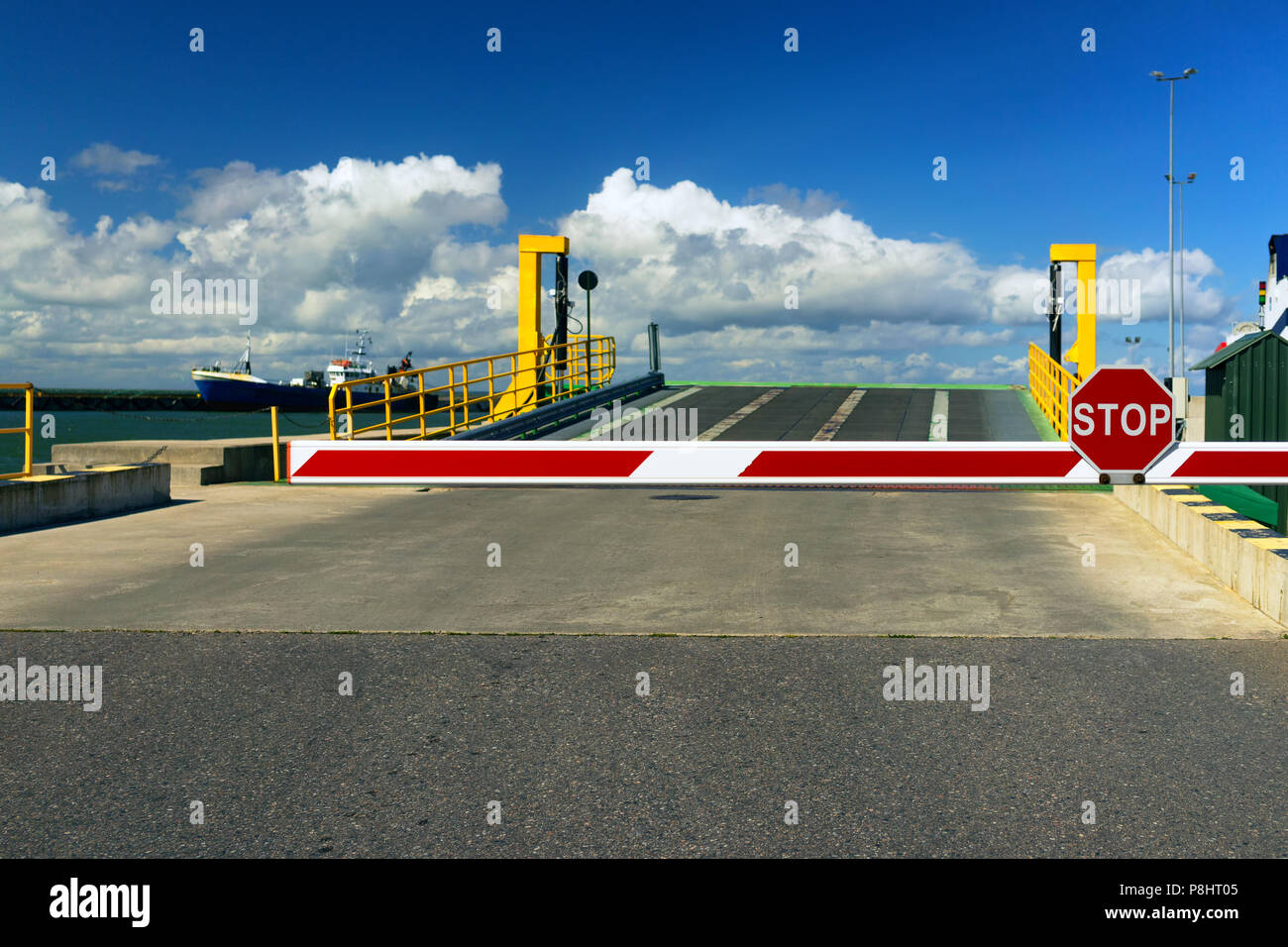 Stop sign on the road of loading on the ferry in the terminal of the ...