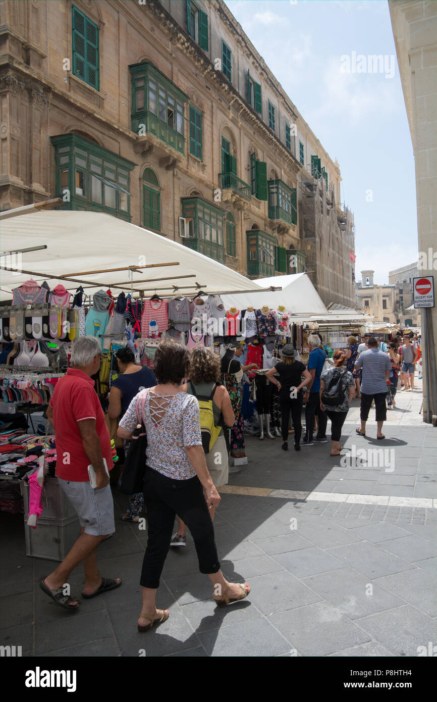 A street market inValletta Malta attracts the tourists with a selection ...