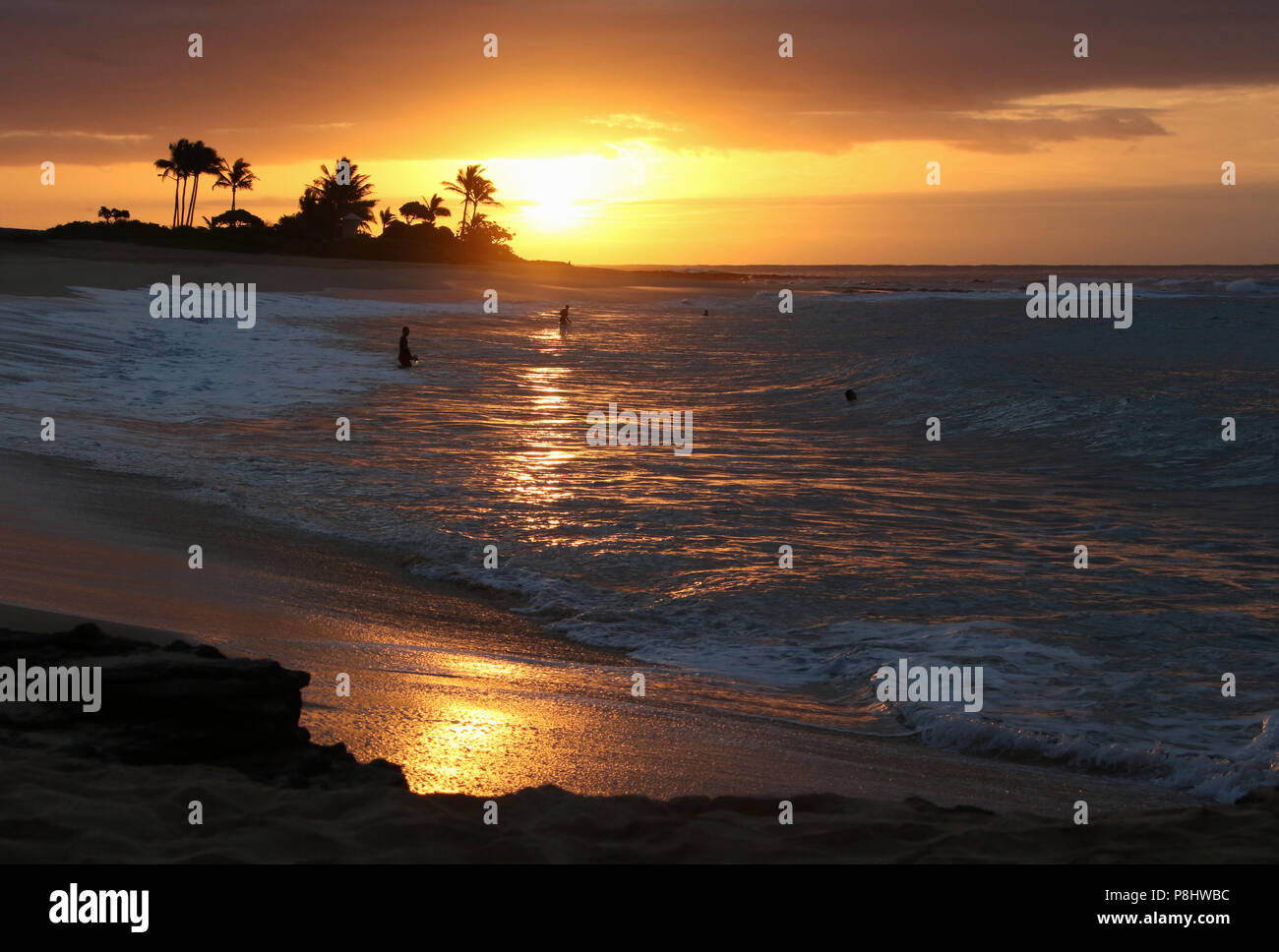Sunrise at Sandy Beach. Surfers and swimmers. Sandy Beach, Halona Cove ...