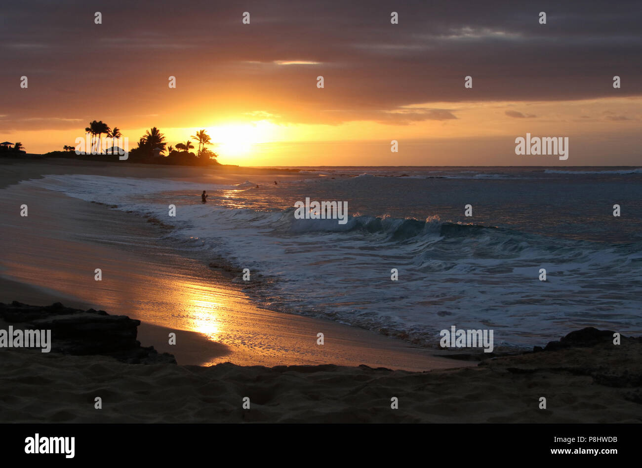 Sunrise at Sandy Beach. Surfers and swimmers. Sandy Beach, Halona Cove ...