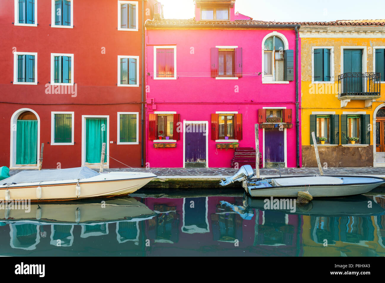 Street with colorful buildings in Burano island, Venice, Italy ...