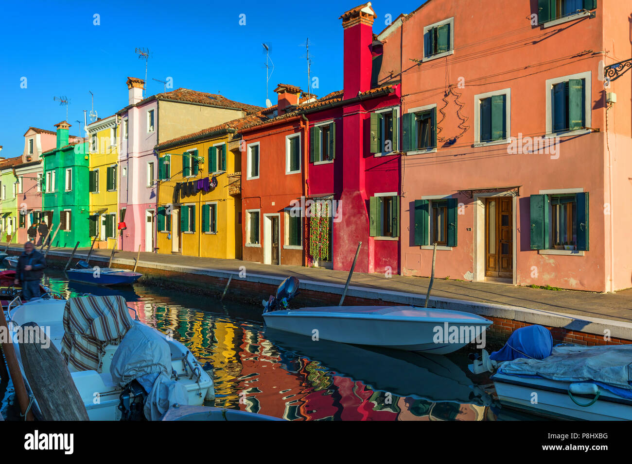 Street with colorful buildings in Burano island, Venice, Italy ...
