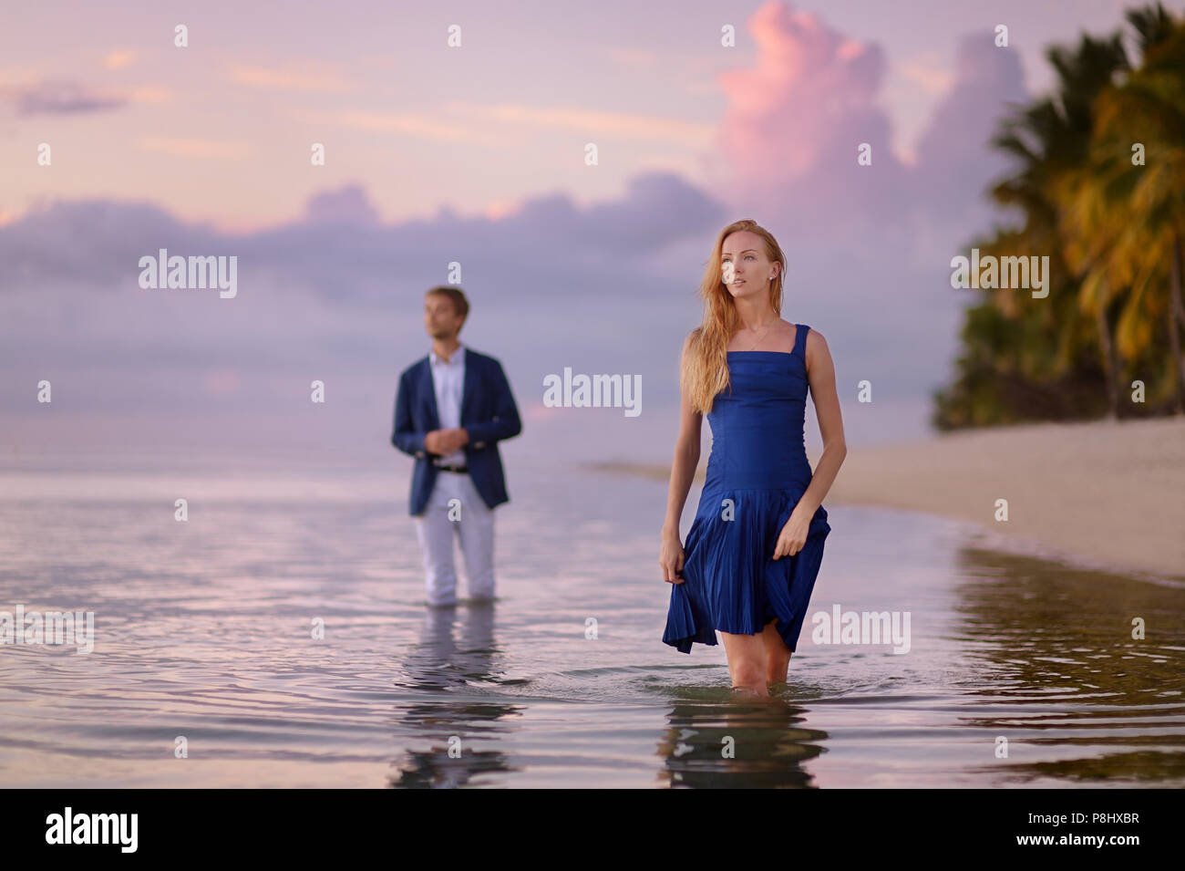 Beautiful romantic couple on a sunset on tropical beach Stock Photo - Alamy