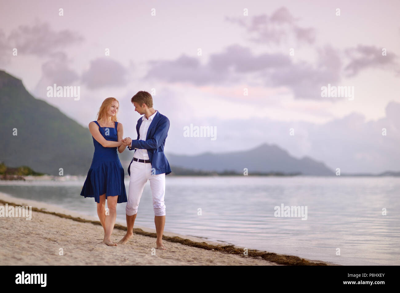 Beautiful romantic couple on a sunset on tropical beach Stock Photo - Alamy