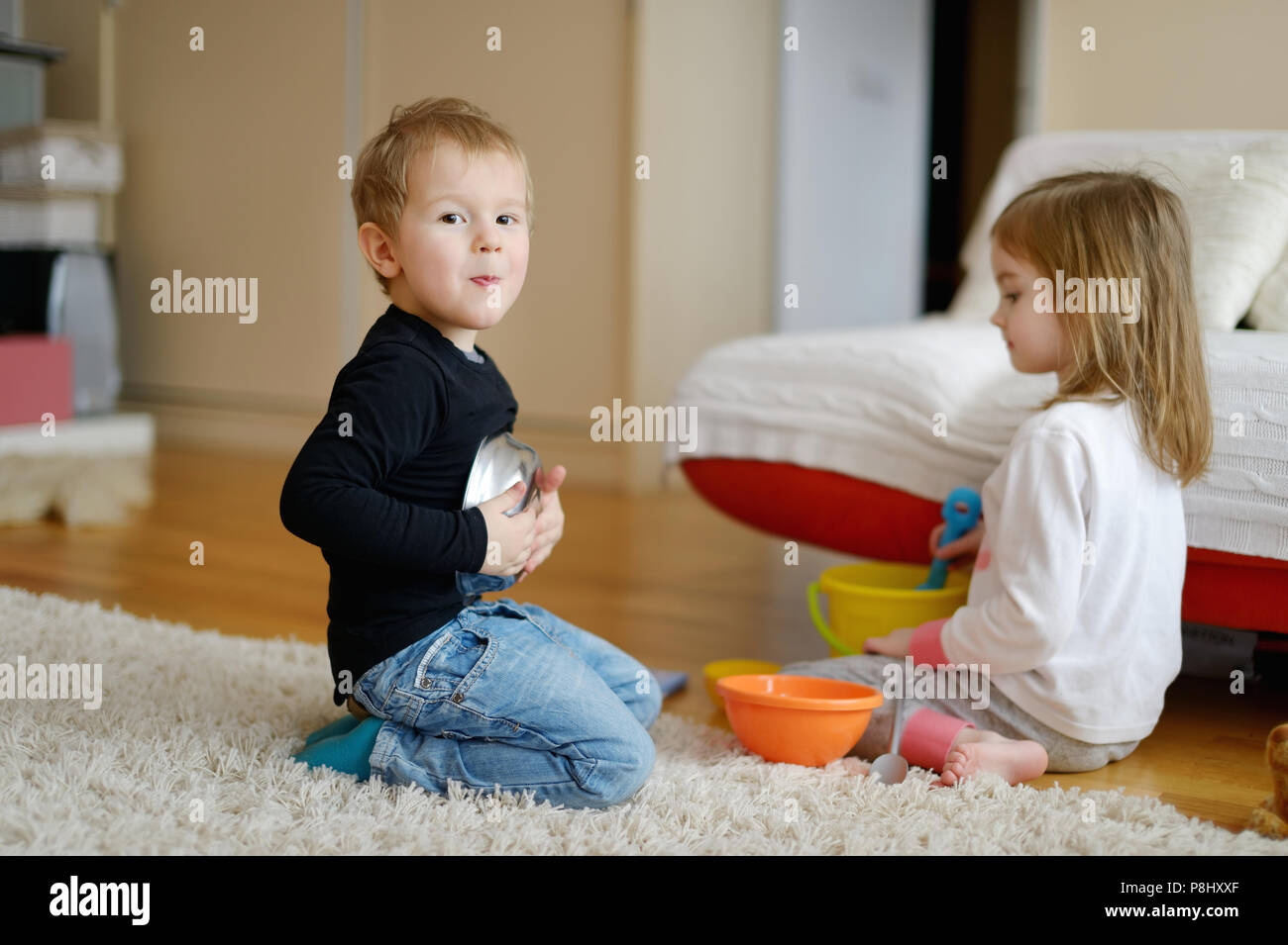 Two kids playing together at home Stock Photo - Alamy