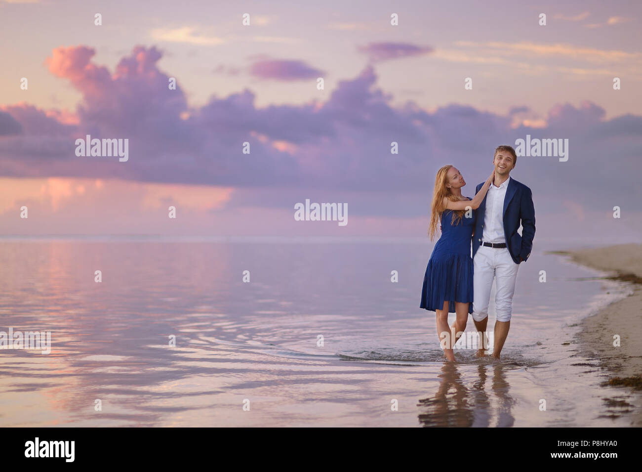 Beautiful romantic couple on a sunset on tropical beach Stock Photo - Alamy