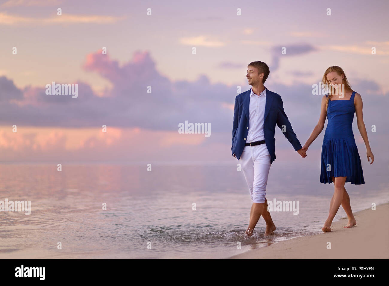 Beautiful romantic couple on a sunset on tropical beach Stock Photo - Alamy