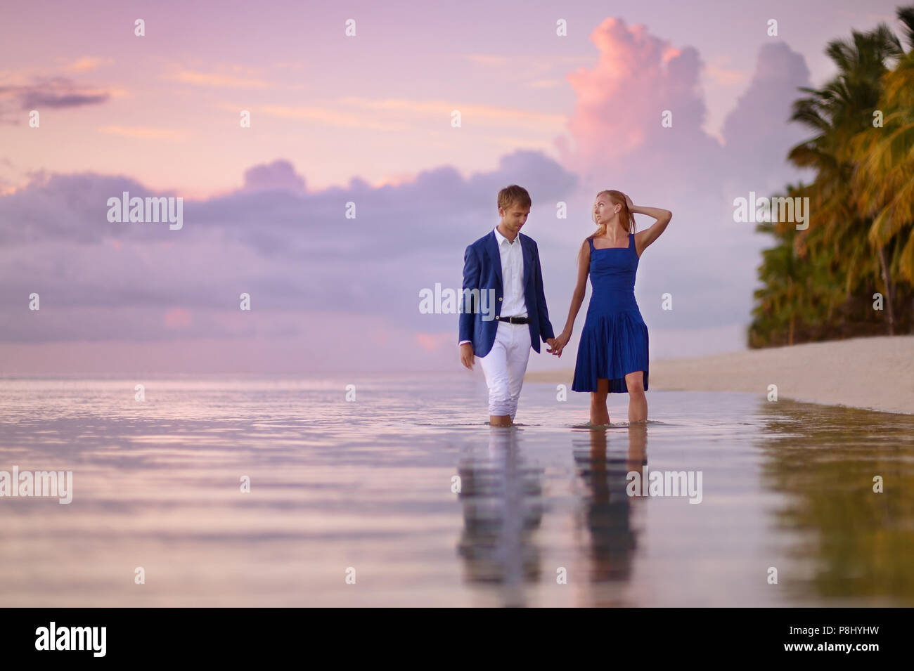 Beautiful romantic couple on a sunset on tropical beach Stock Photo - Alamy