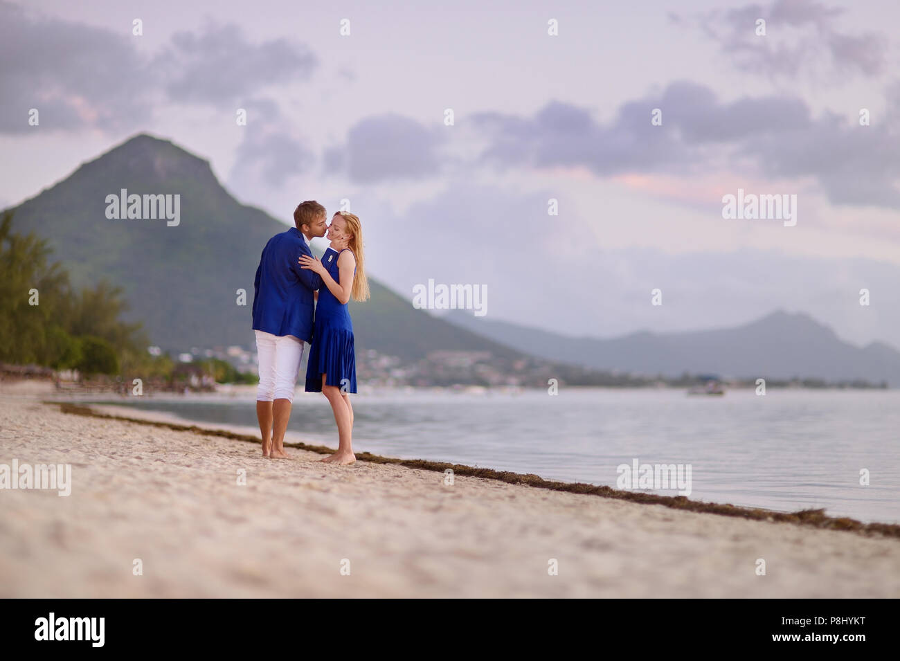 Beautiful romantic couple on a sunset on tropical beach Stock Photo - Alamy