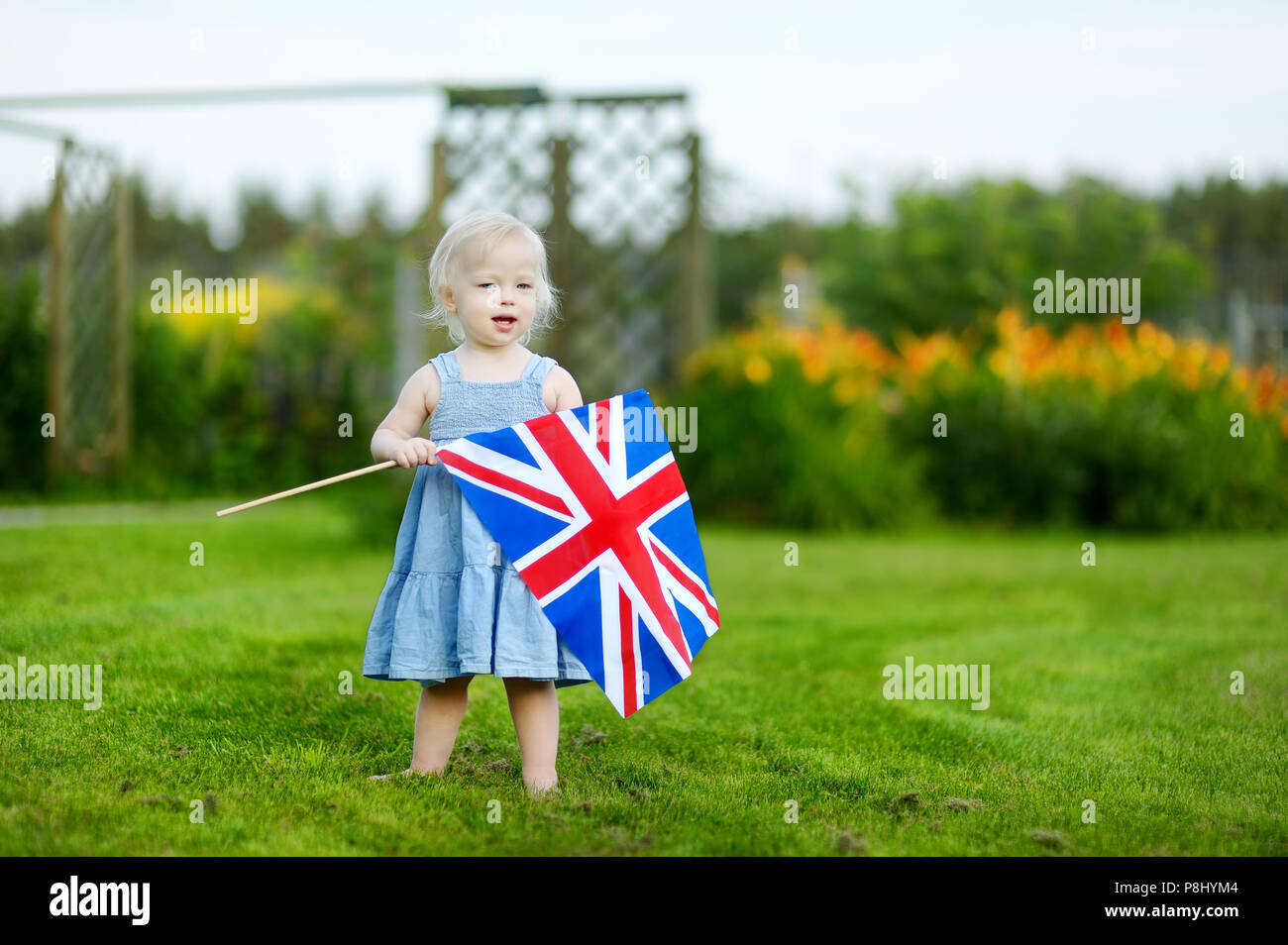 Adorable little girl with United Kingdom flag outdoors Stock Photo - Alamy