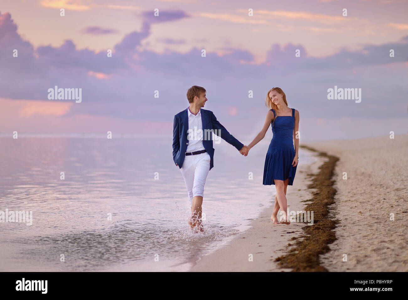 Beautiful romantic couple on a sunset on tropical beach Stock Photo - Alamy
