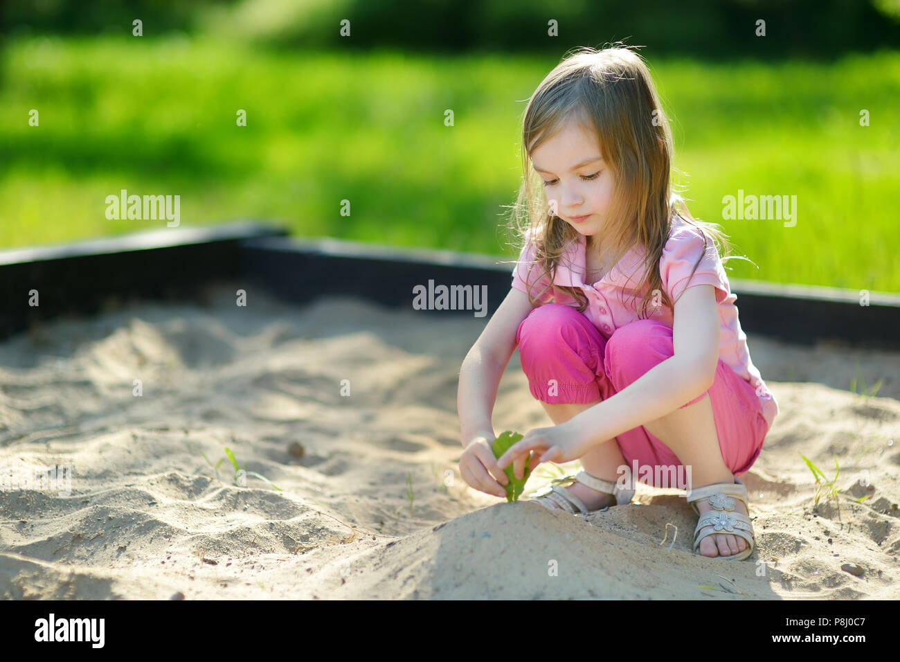 Adorable Little Girl Playing In A Sandbox Stock Image Image Of