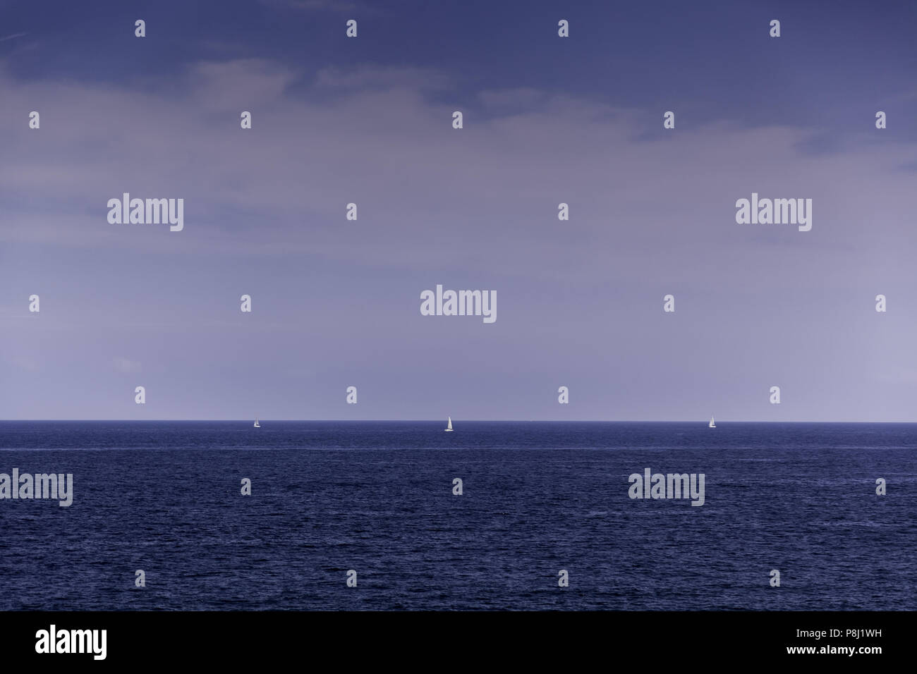 Boats in the distance, detail of boats on the high seas Stock Photo - Alamy