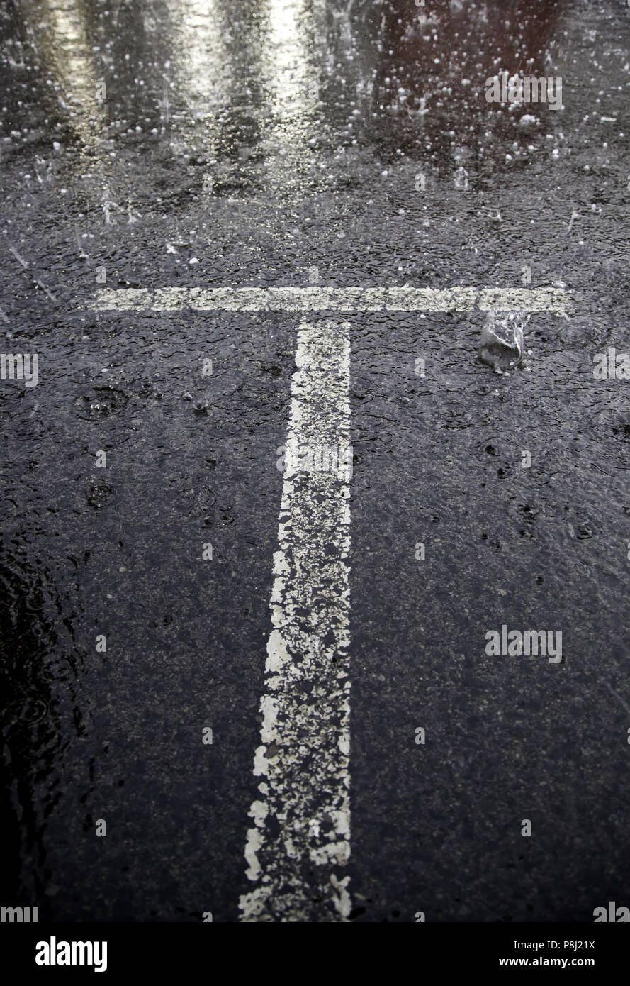 Rain on the asphalt, detail of cold and rain Stock Photo - Alamy