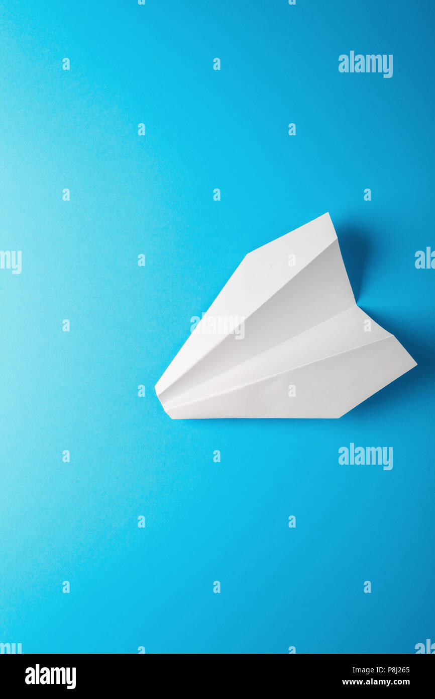 paper airplane on blue background. travel concept Stock Photo - Alamy