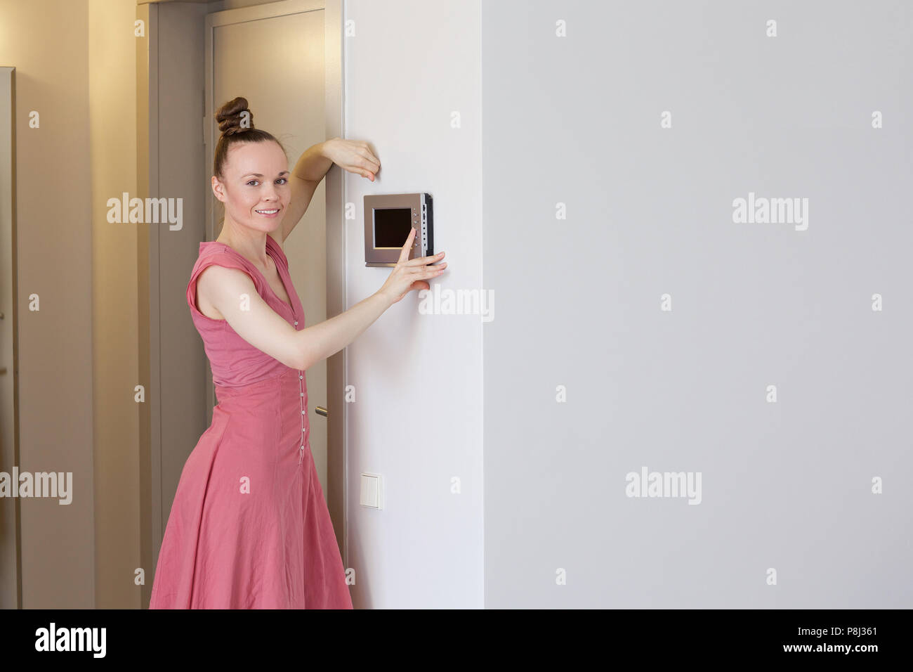 Young lady between 30 and 40 years old and intercom Stock Photo - Alamy