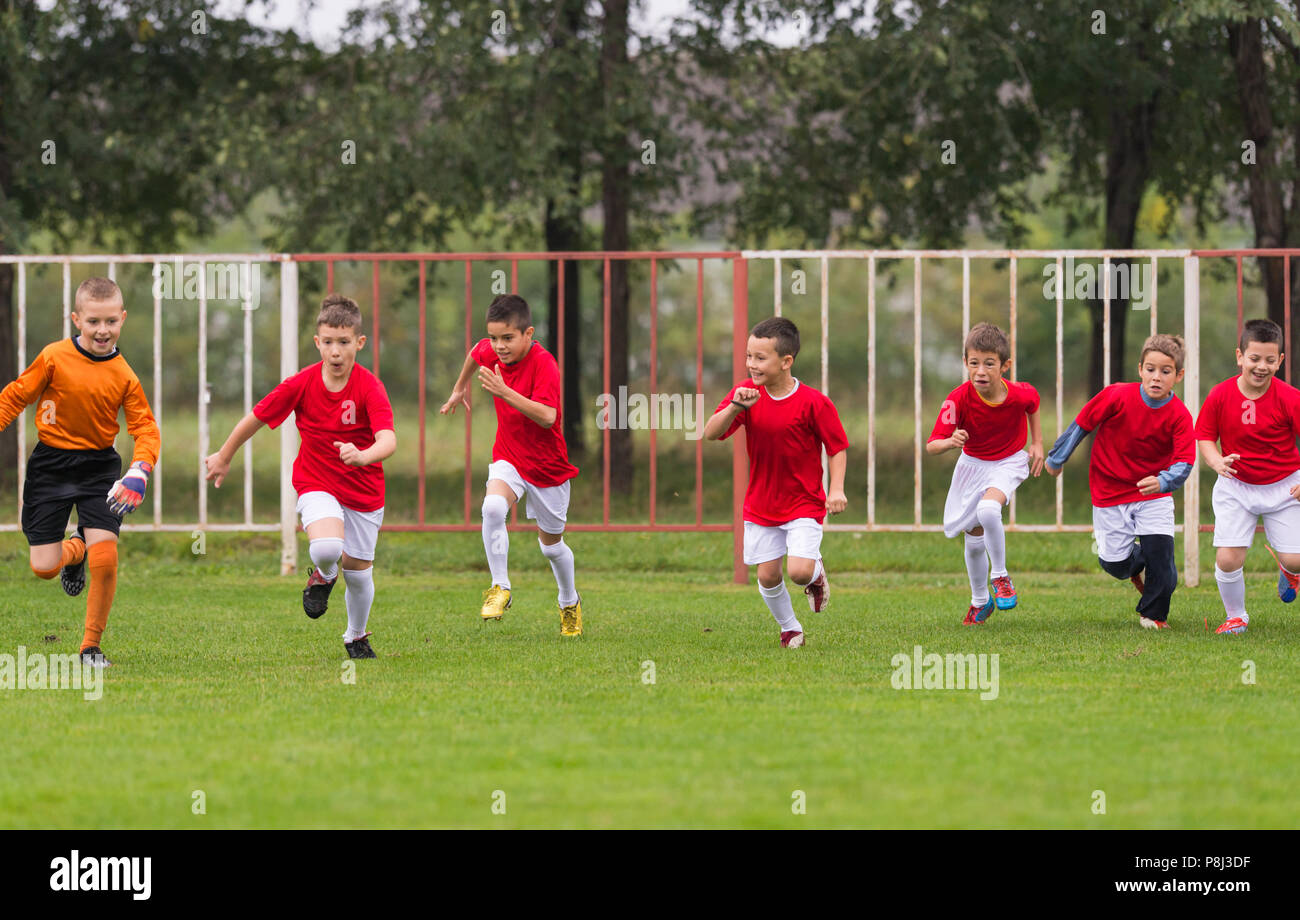 Soccer training for kids in football field Stock Photo - Alamy
