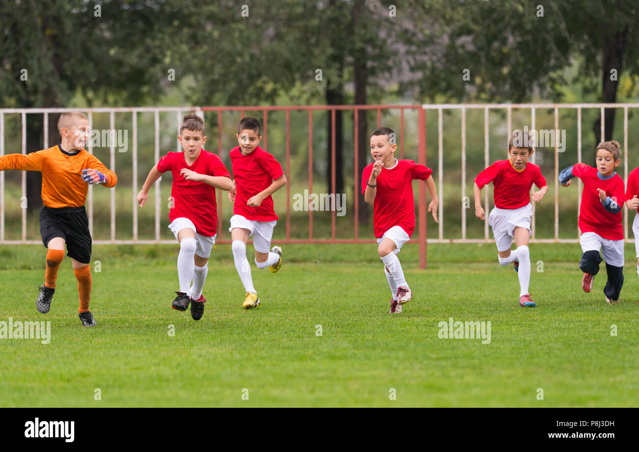 Soccer training for kids in football field Stock Photo - Alamy