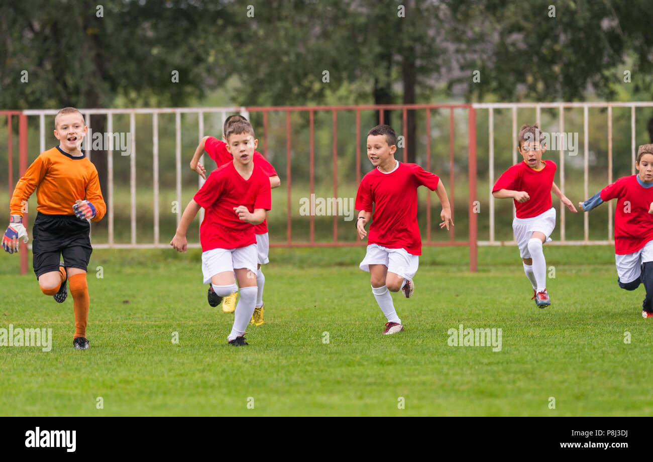 Soccer training for kids in football field Stock Photo - Alamy