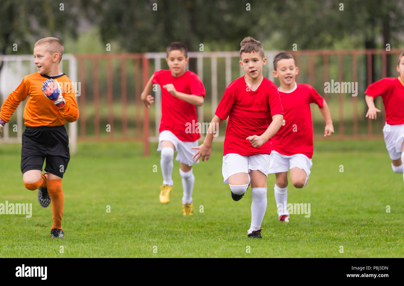 Soccer training for kids in football field Stock Photo - Alamy