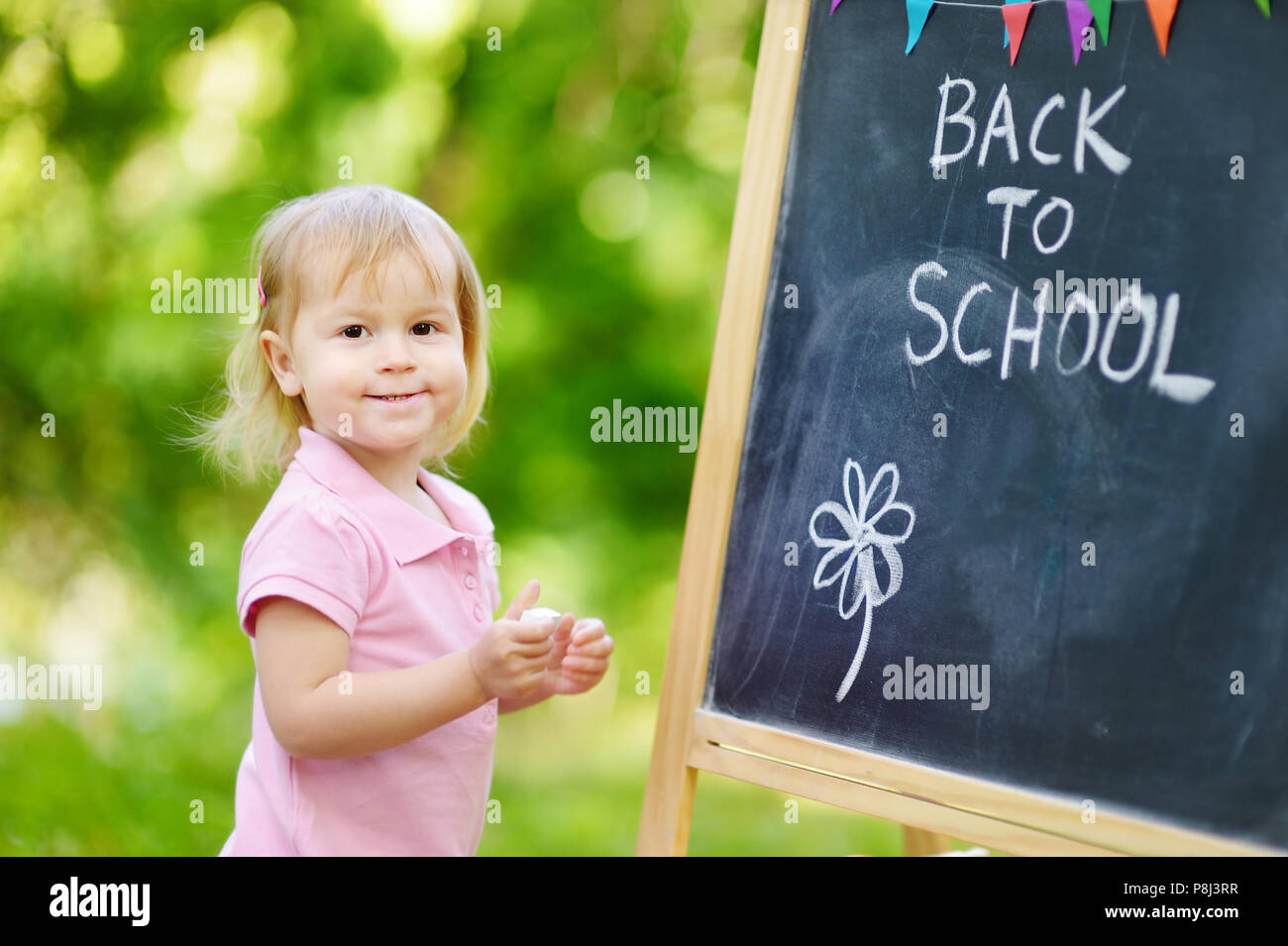 Adorable little girl feeling excited about going to preschool for the ...