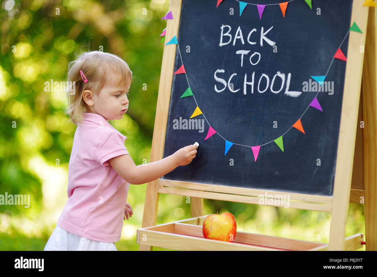 Adorable little girl feeling excited about going to preschool for the ...