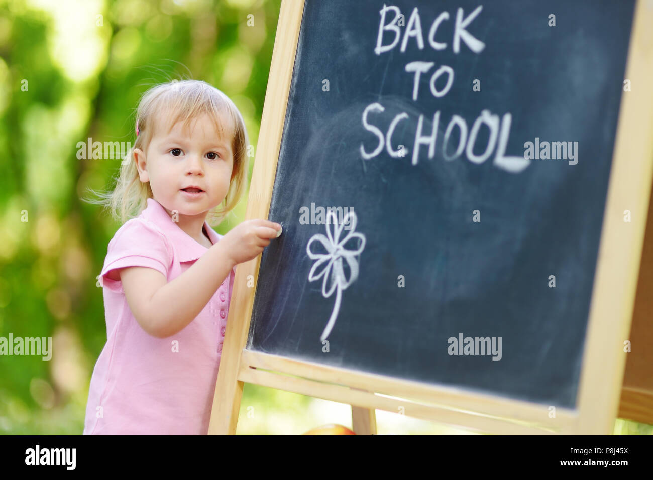 Adorable little girl feeling excited about going to preschool for the ...