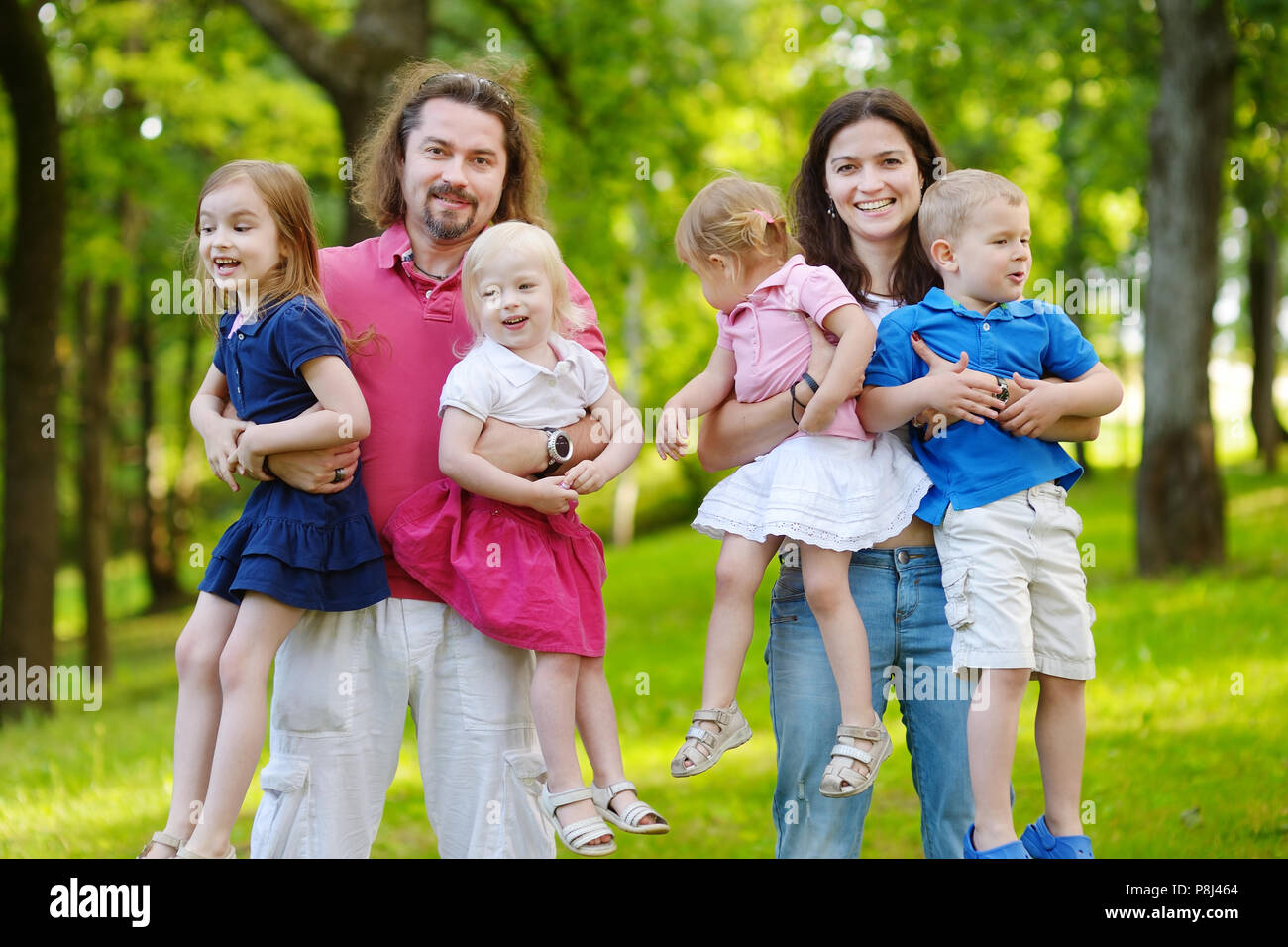 Happy big family of six having fun at summer park on beautiful sunny ...