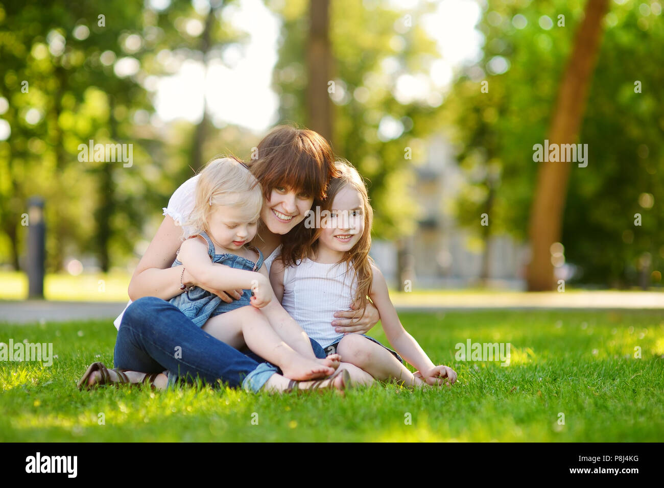 Child hugging infant siblings hi-res stock photography and images - Alamy