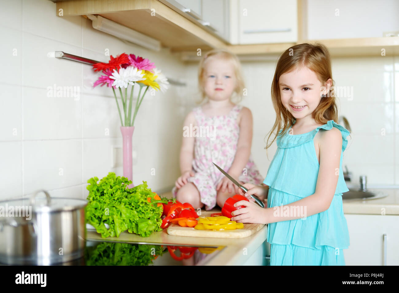 Two sisters cooking hi-res stock photography and images - Alamy