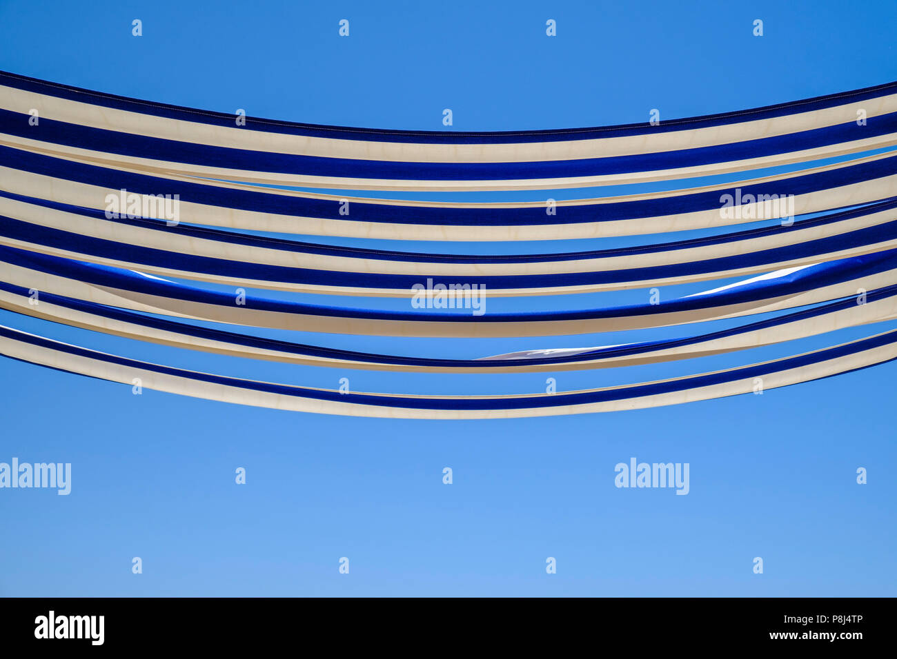 Abstract effect of the blue and white striped fabric of a restaurant ...