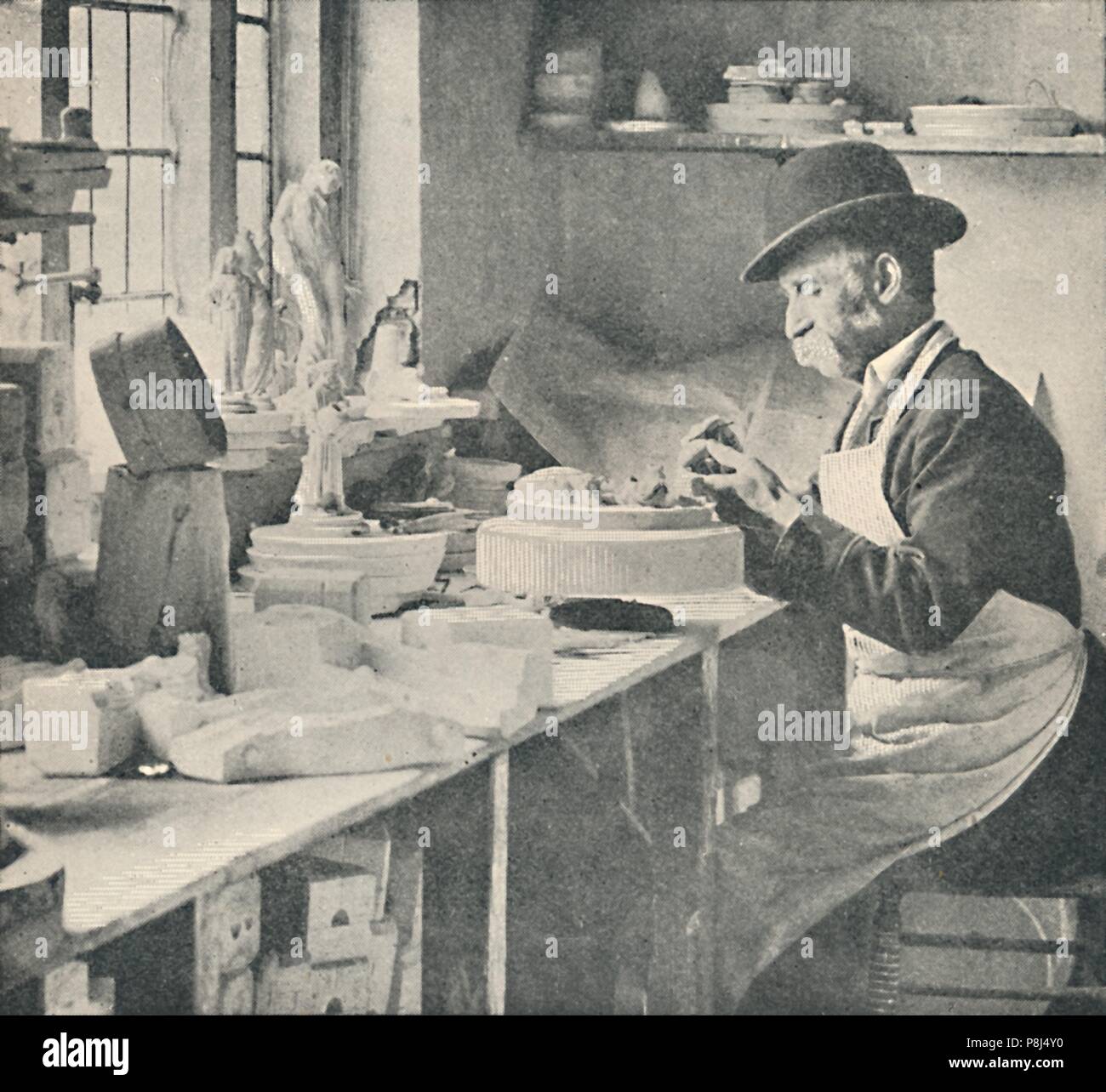 'Trimming up parts of raw clay', c1917. Artist: Unknown Stock Photo - Alamy