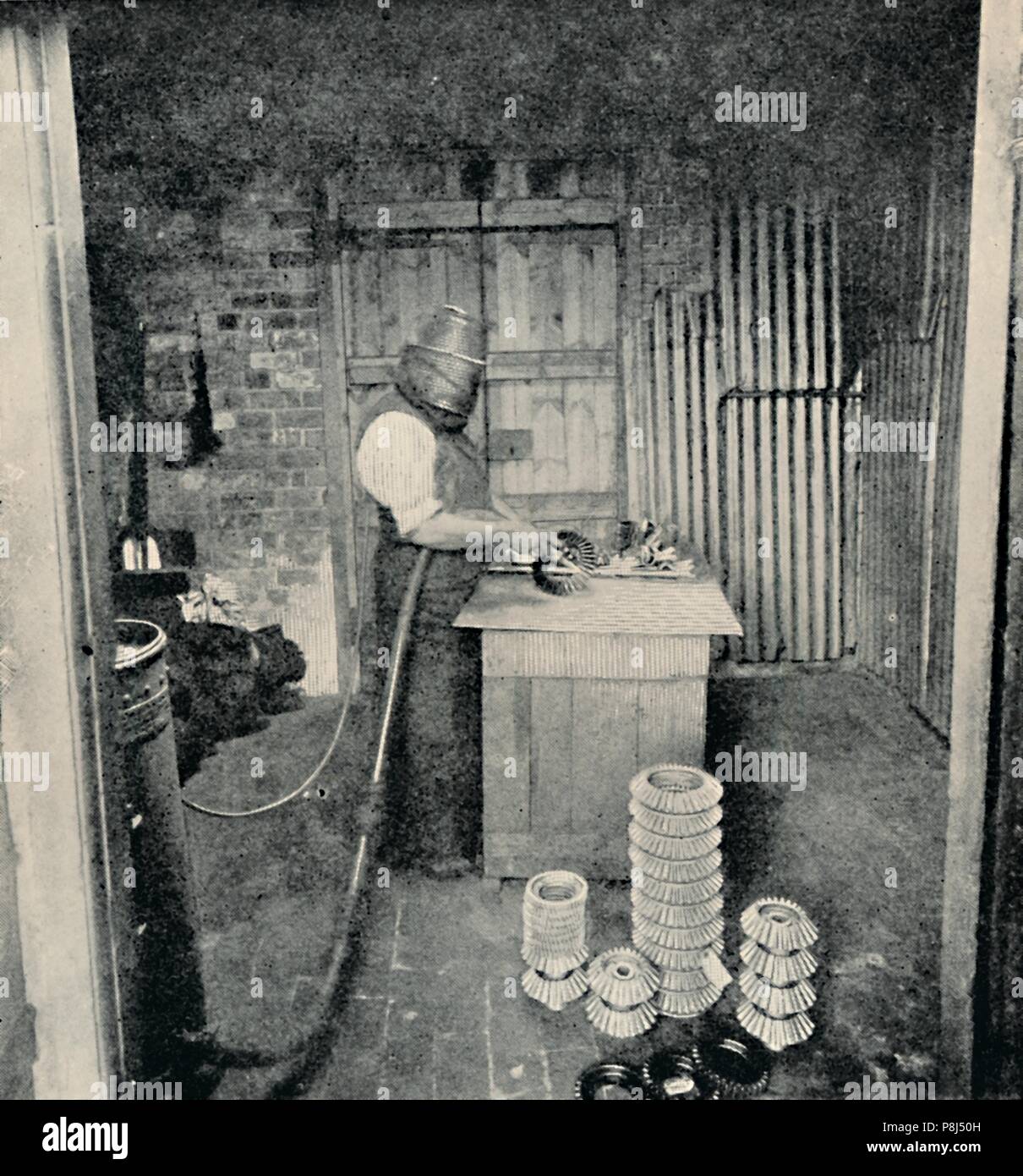'Sand-blasting Gear Wheels', c1917. Artist: Unknown Stock Photo - Alamy