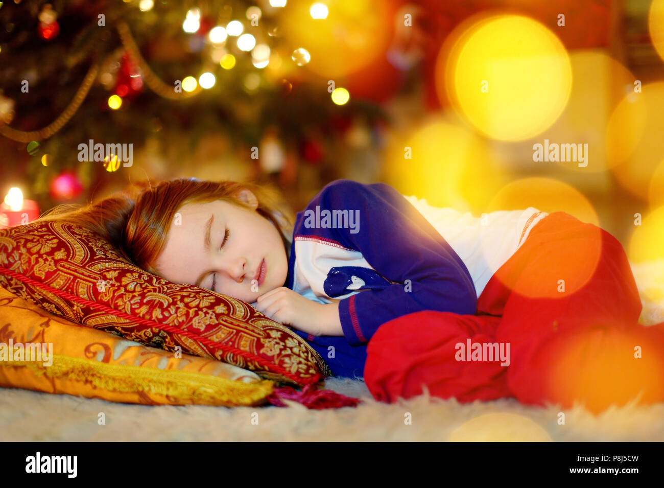 Child girl under tree sleeping hi-res stock photography and images - Alamy