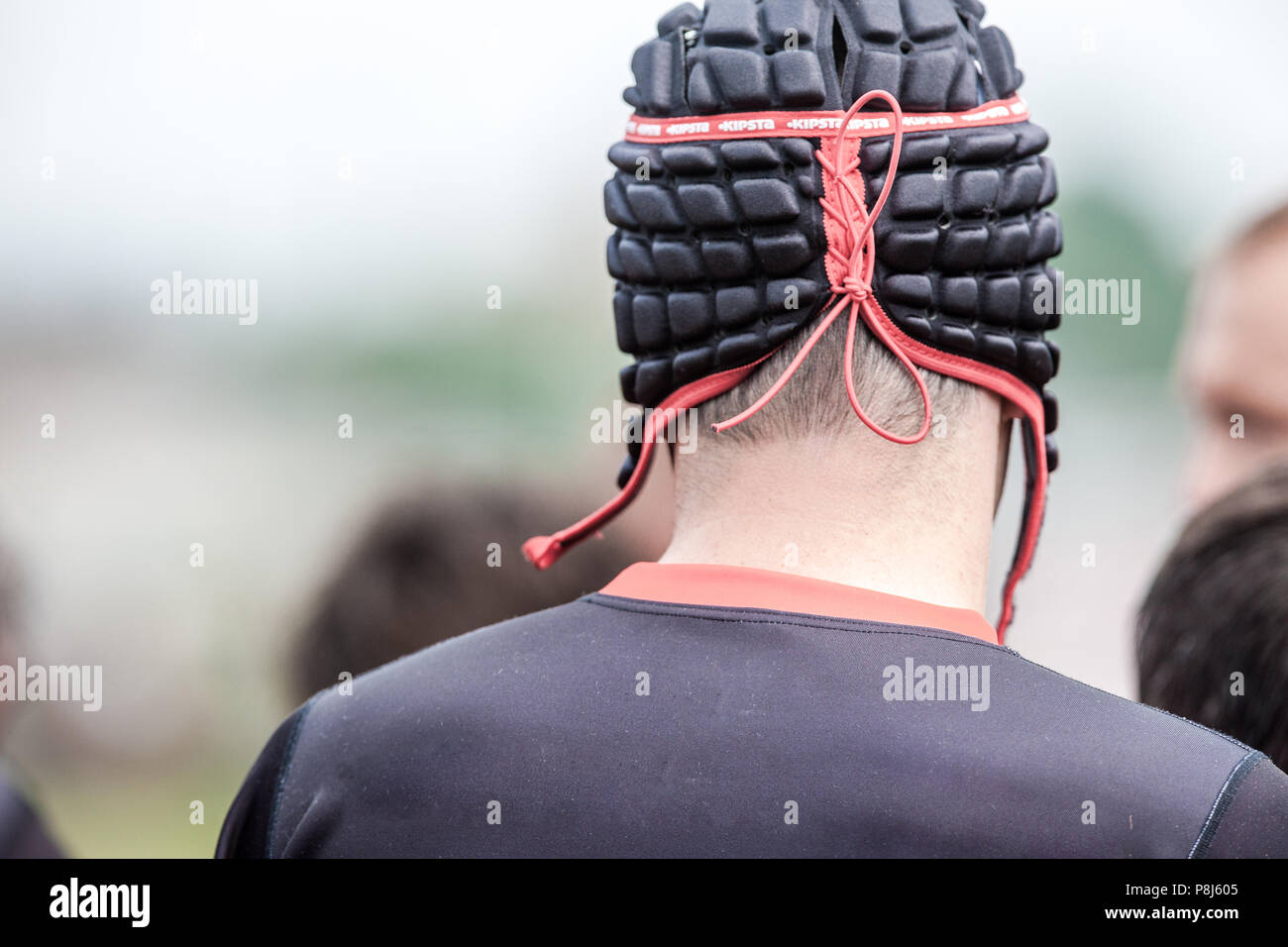 Rugby player with protective helmet Stock Photo - Alamy