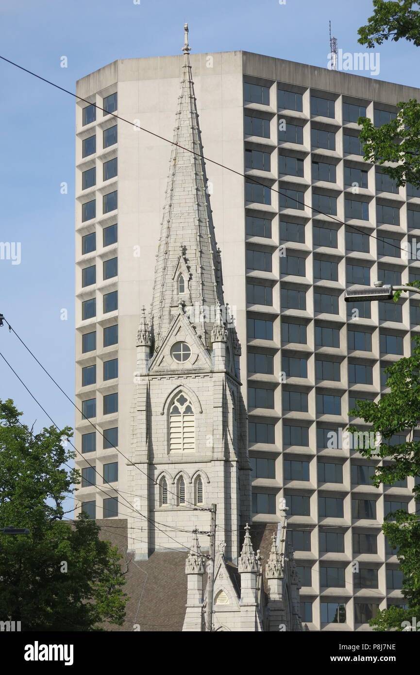 The contrast of ancient and modern with the granite spire (tallest in N ...