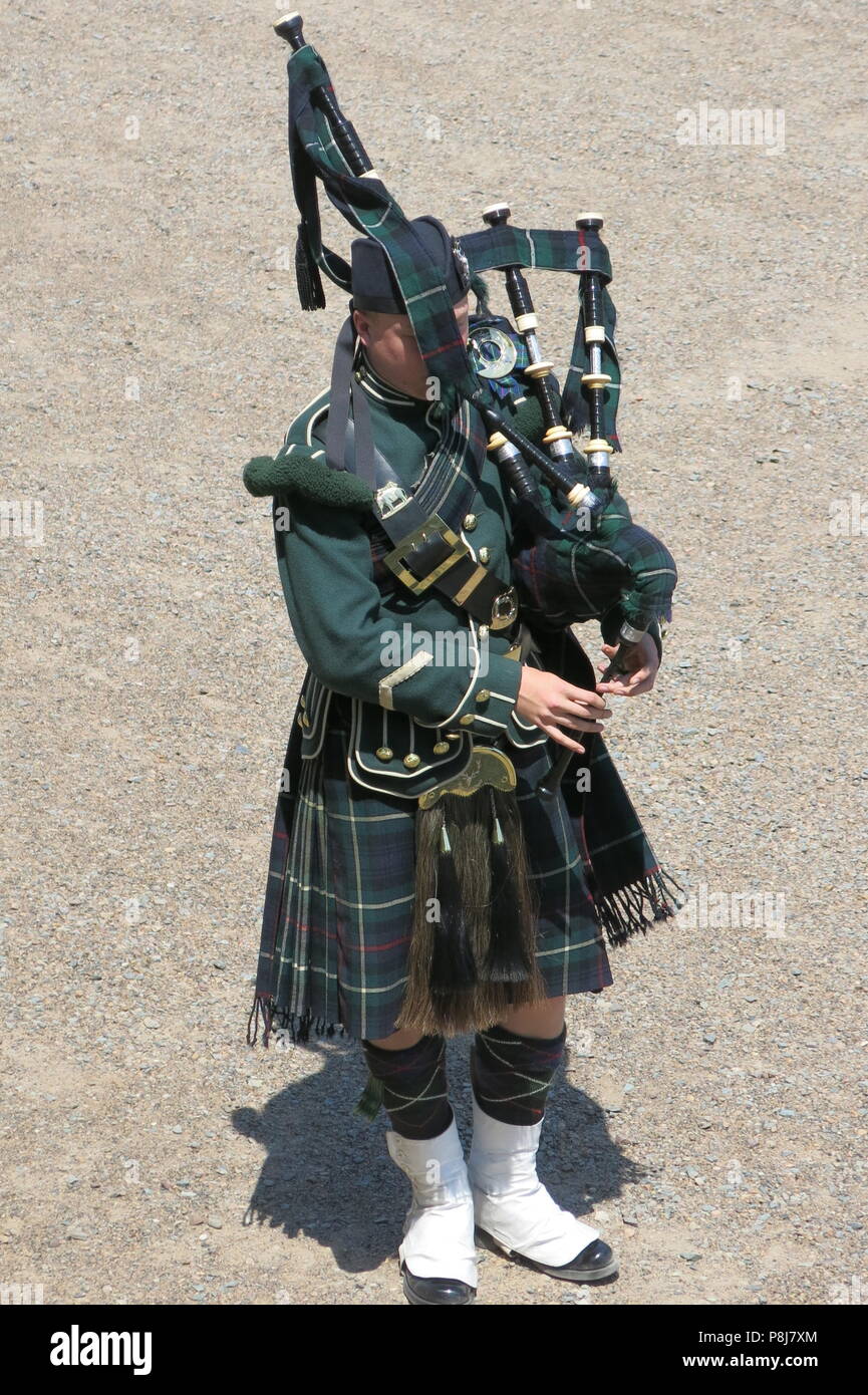 Bagpipers and drummers of the 78th Highlanders perform regimental tunes ...