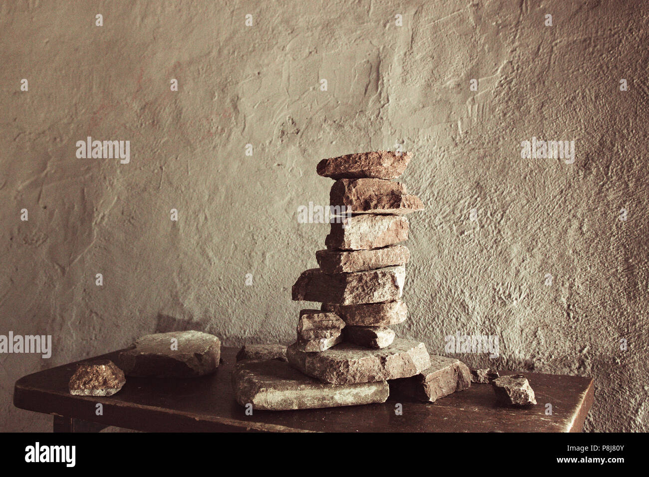 Stacked stone pyramid against the wall Stock Photo - Alamy