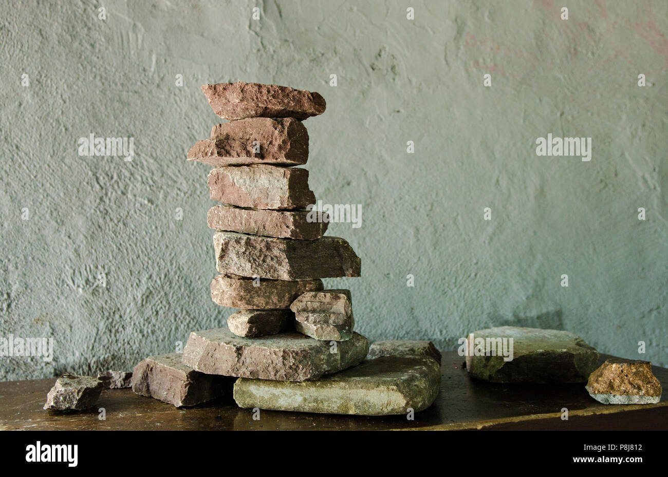 Stacked stone pyramid against the wall Stock Photo - Alamy