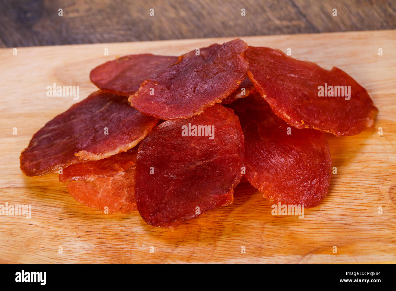 Dry pork meat heap over wooden Stock Photo - Alamy