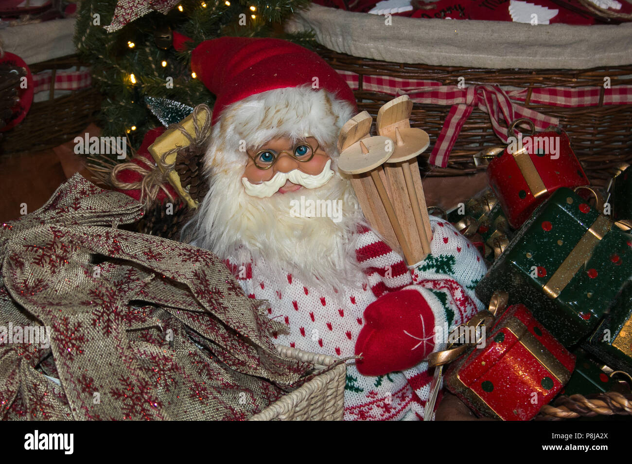 Beautiful Santa Claus with blue eyes and gift Stock Photo - Alamy