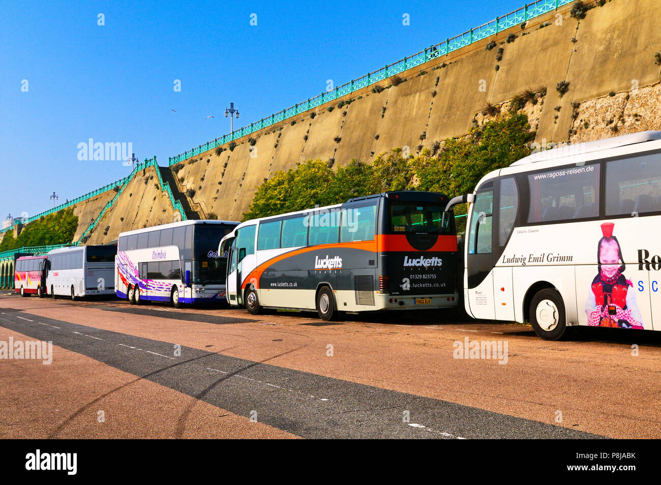 European coaches parked along Madeira Drive on Brighton seafront, East ...