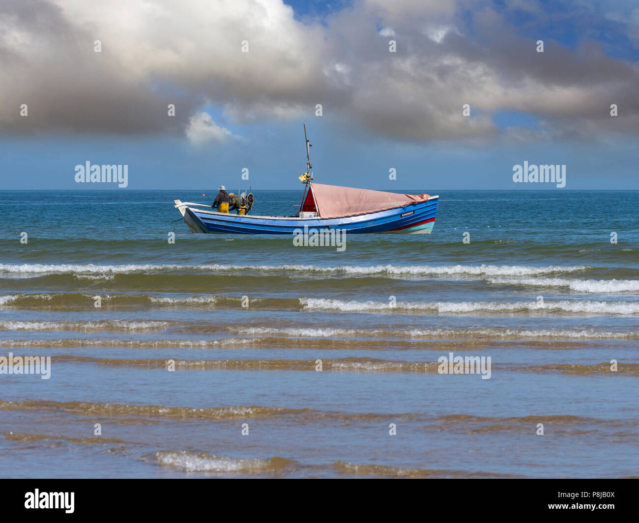 Fishing with traditional coble boat at Alnmouth with Couquet Isand in ...
