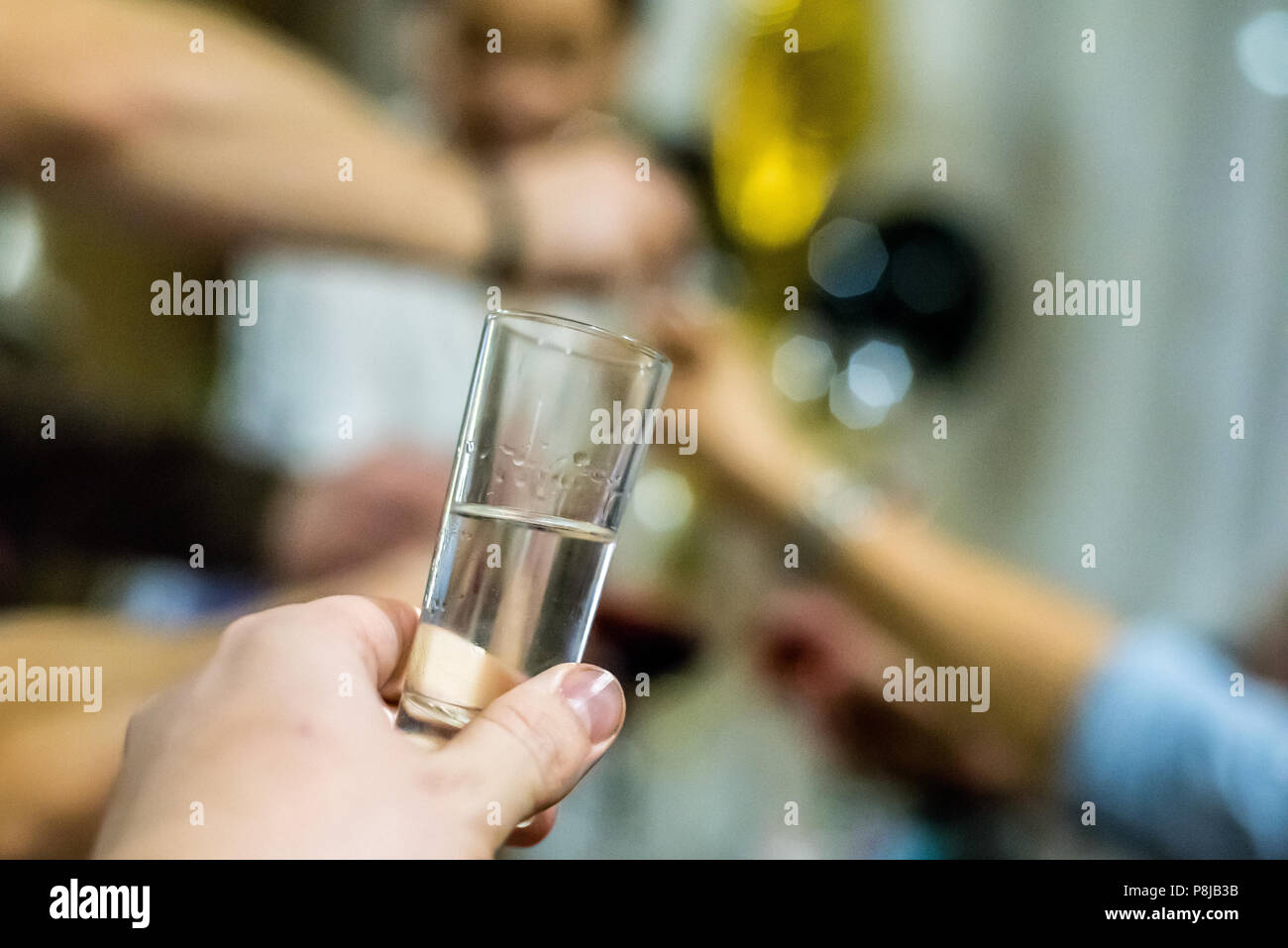 Hand and vodka shot glass hi-res stock photography and images - Alamy