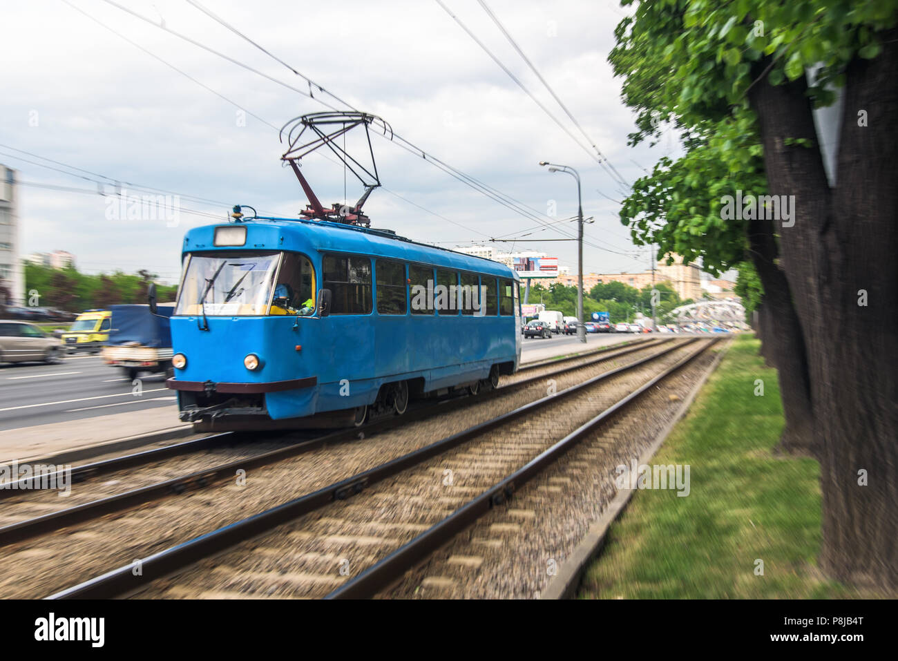 European city blue tram motion on street Stock Photo - Alamy