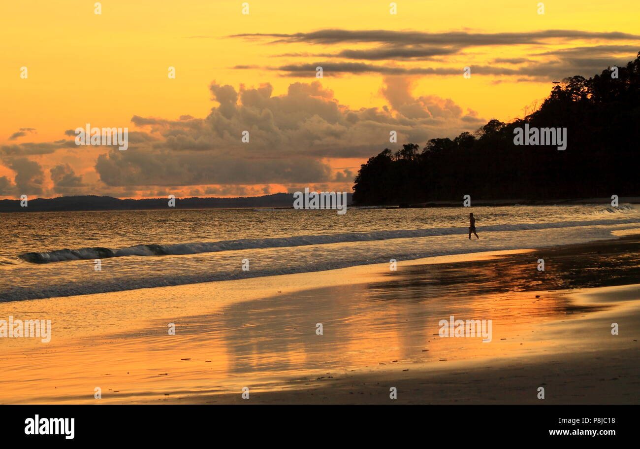 As the sun goes down spreading its golden hue allover the sky and the ...